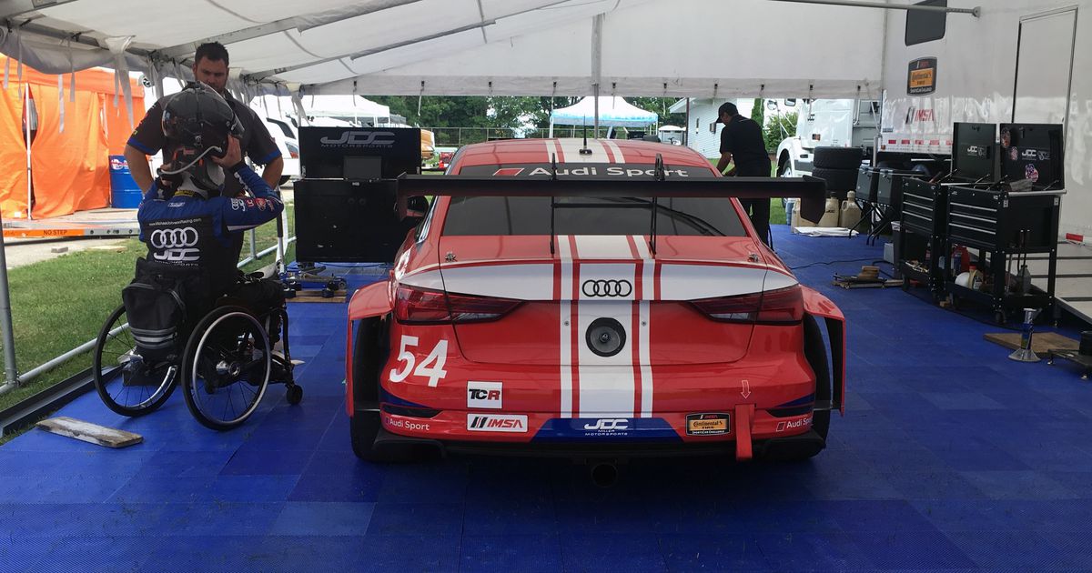 Paraplegic race car driver scores 1st pro win, seeks more