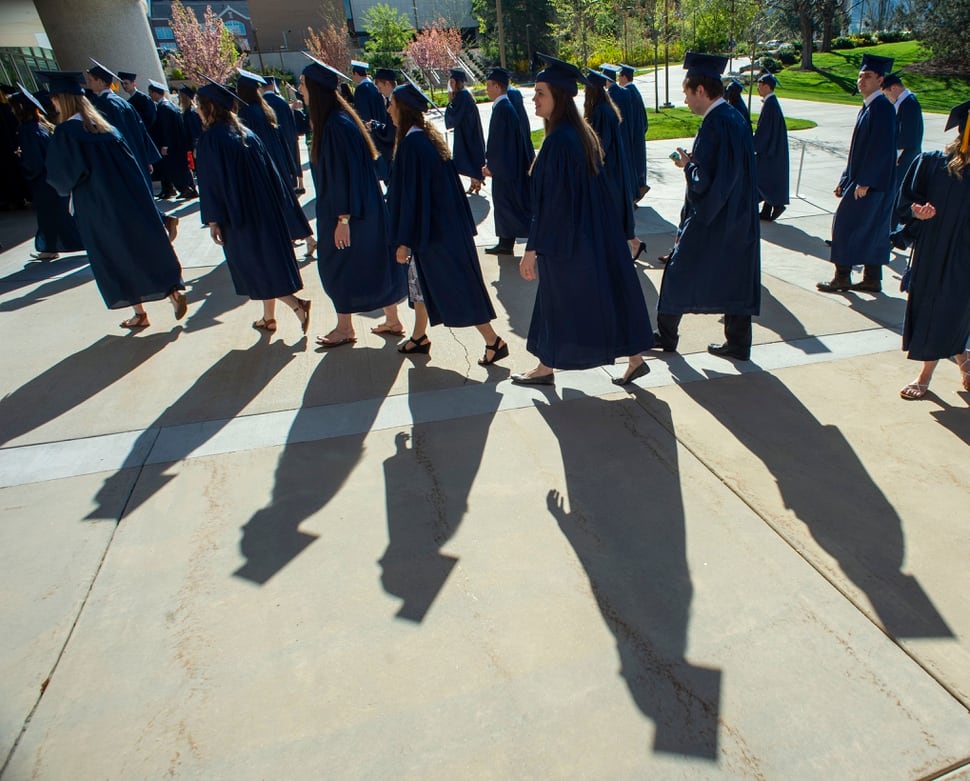 BYU graduates its biggest class ever with blue gowns, smiles and jokes ...