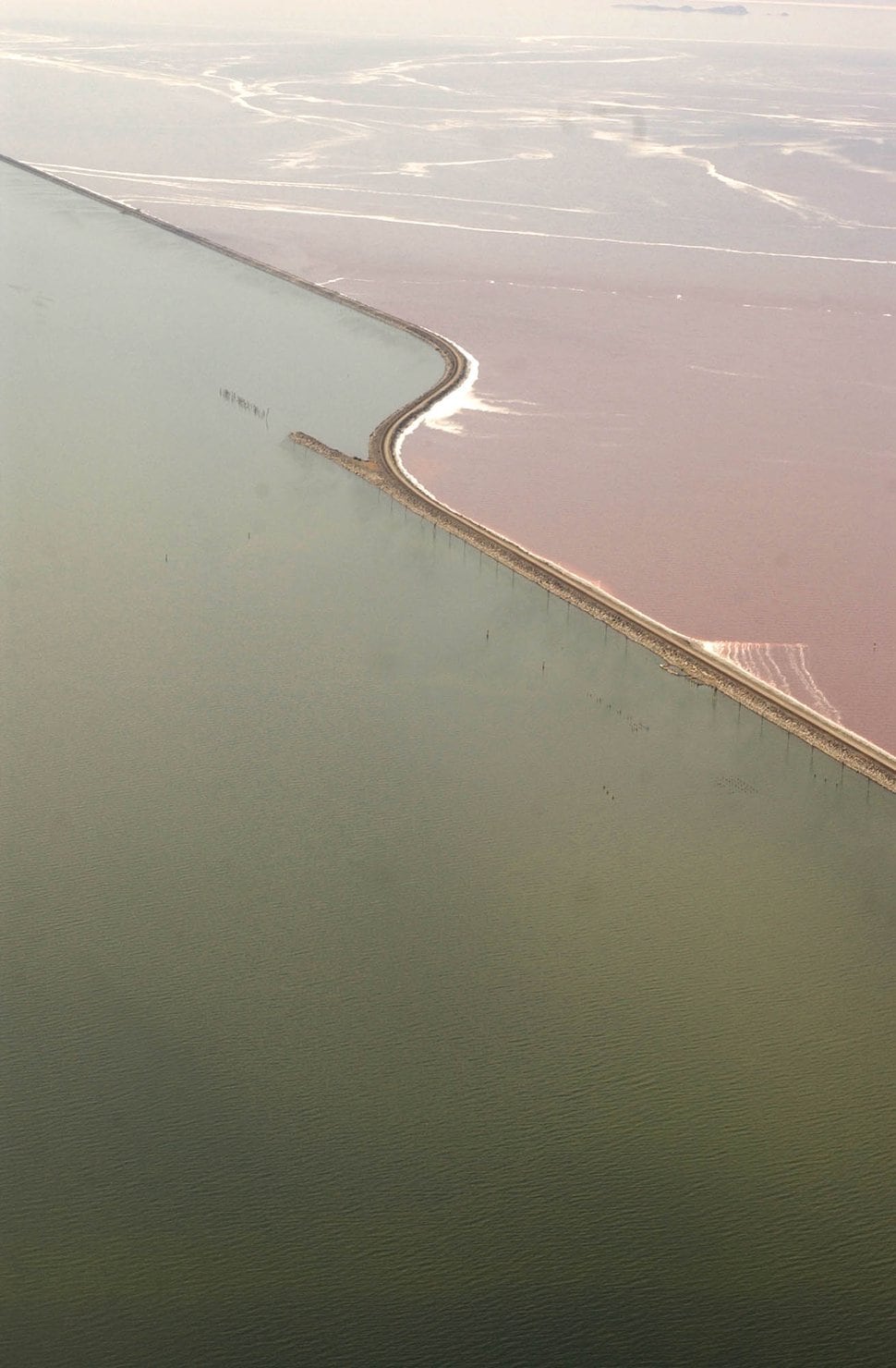 Photos: Crews breach Great Salt Lake causeway to restore balance of ...