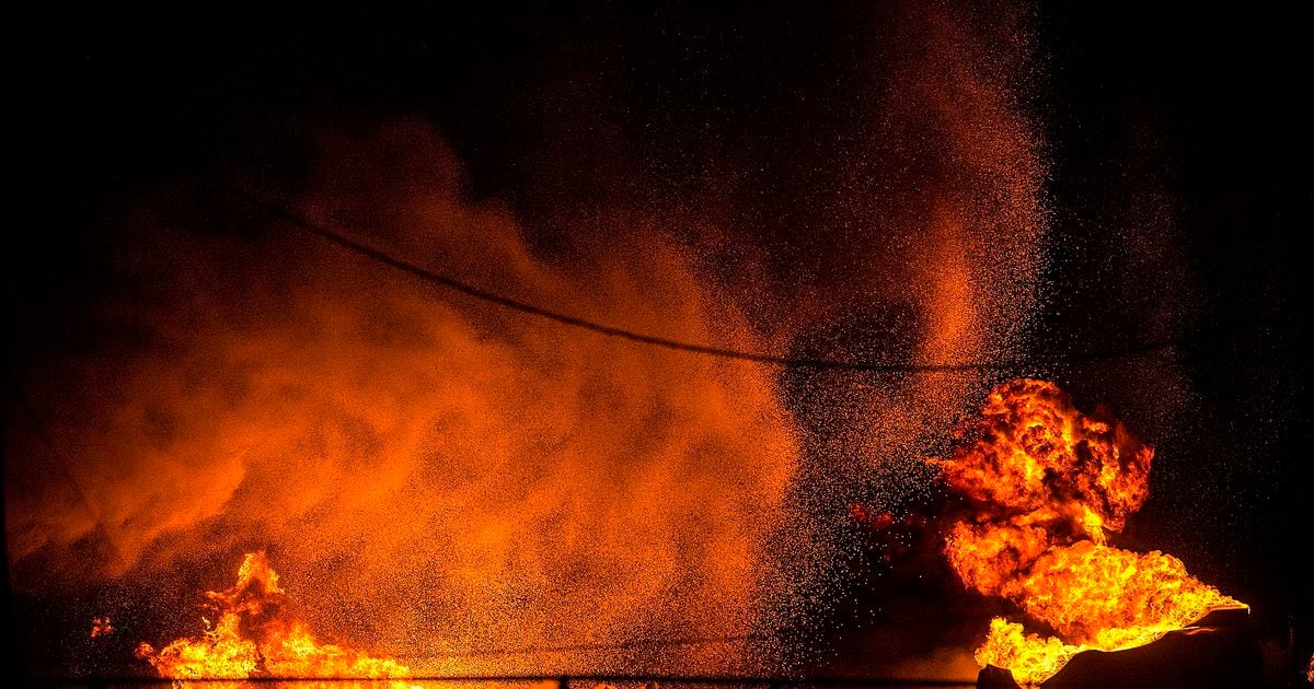 Flames jump into the air after thousands of gallons of fuel catch fire ...