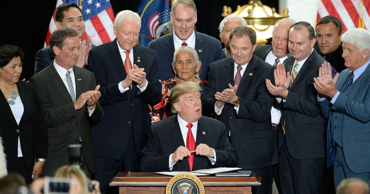 Trump greeted by cheers and protests as he visits Utah, trims 2 million ...